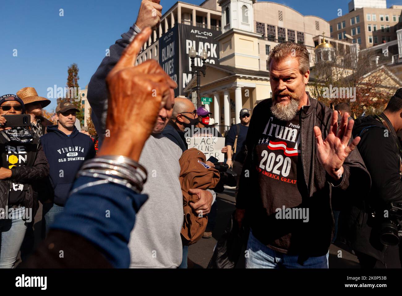 A Trump supporter harasses an anti-racism activist in Black Lives ...