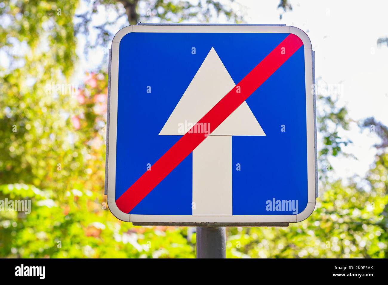 One way street road sign, White arrow in blue background, crossed out ...