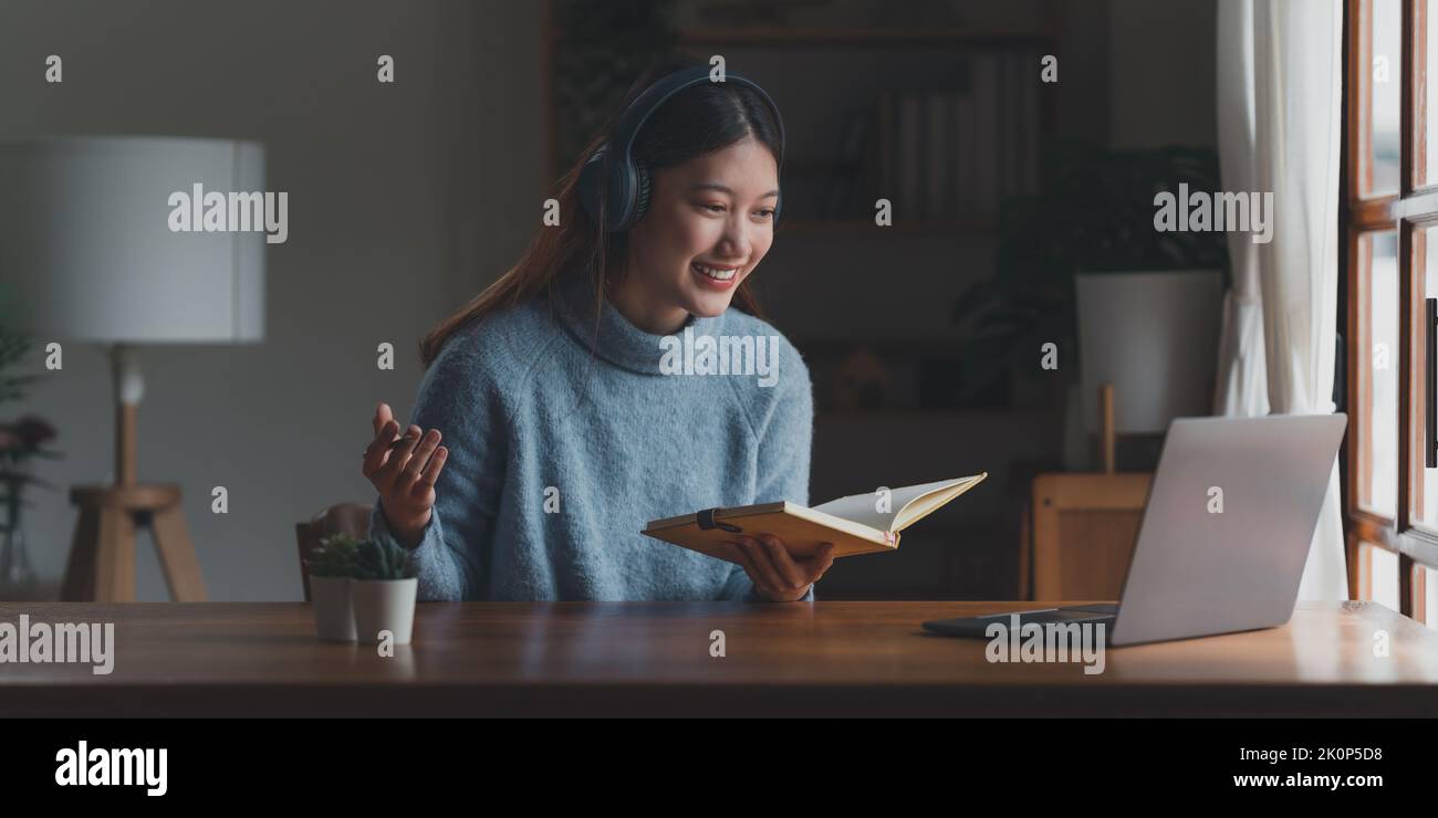 Young college student have question and answer to teacher by video call ...