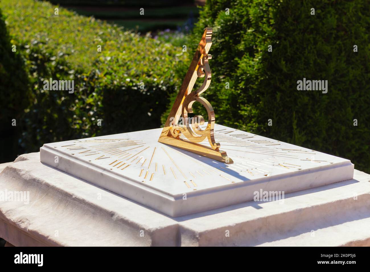 Beautiful Golden twisted pointer or gnomon of sundial casts shadow on ...