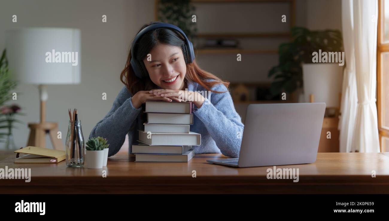 Young college student have question and answer to teacher by video call ...