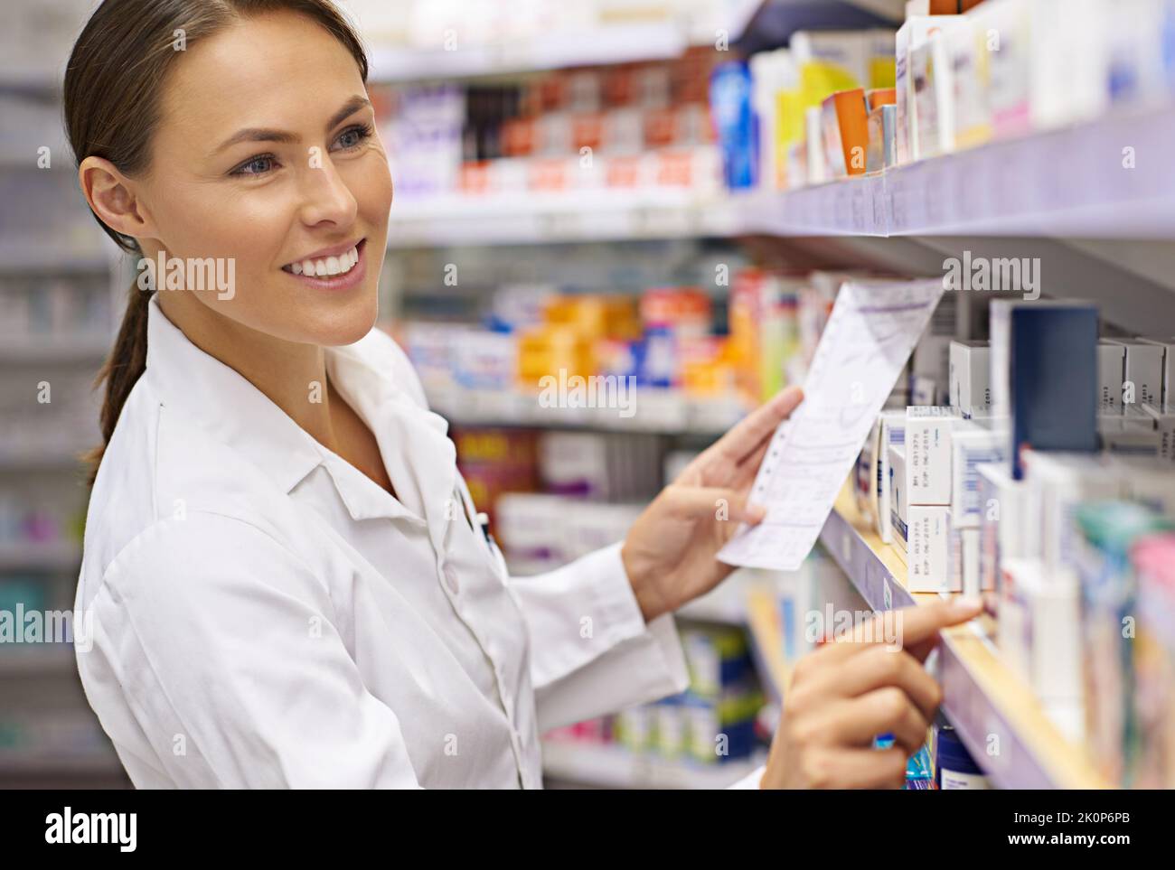 Finding the best treatment possible. an attractive young pharmacist ...