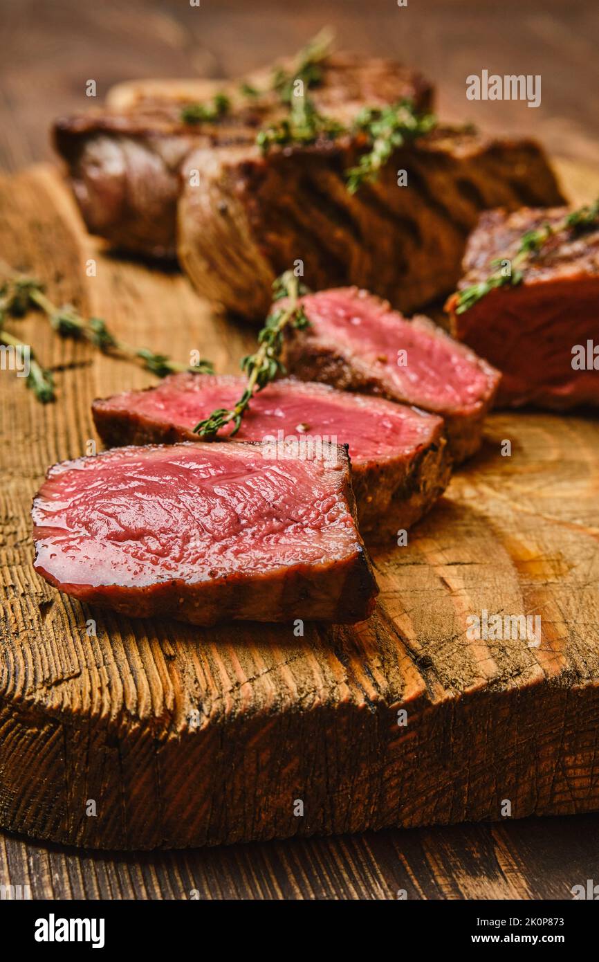 Closeup view of juicy grilled beef steak slices Stock Photo - Alamy