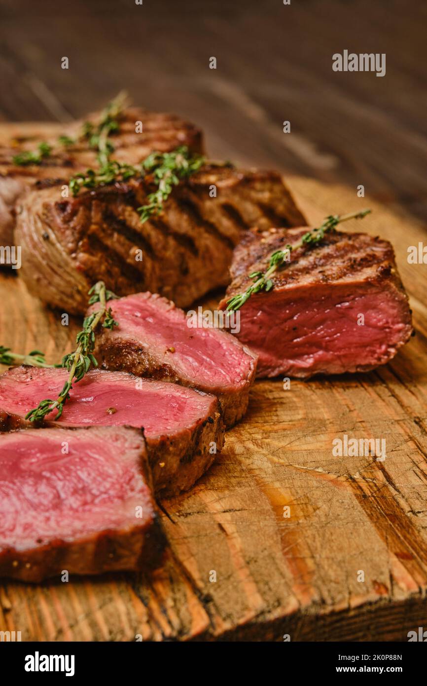 Closeup view of medium rare beef steak, prime strip loin meat Stock ...