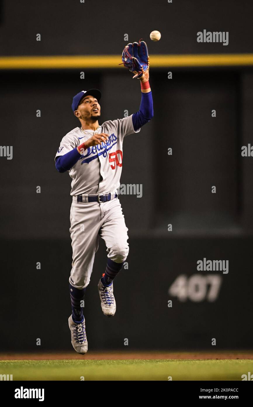 Los Angeles Dodgers second baseman Mookie Betts (50) jogs off the field ...