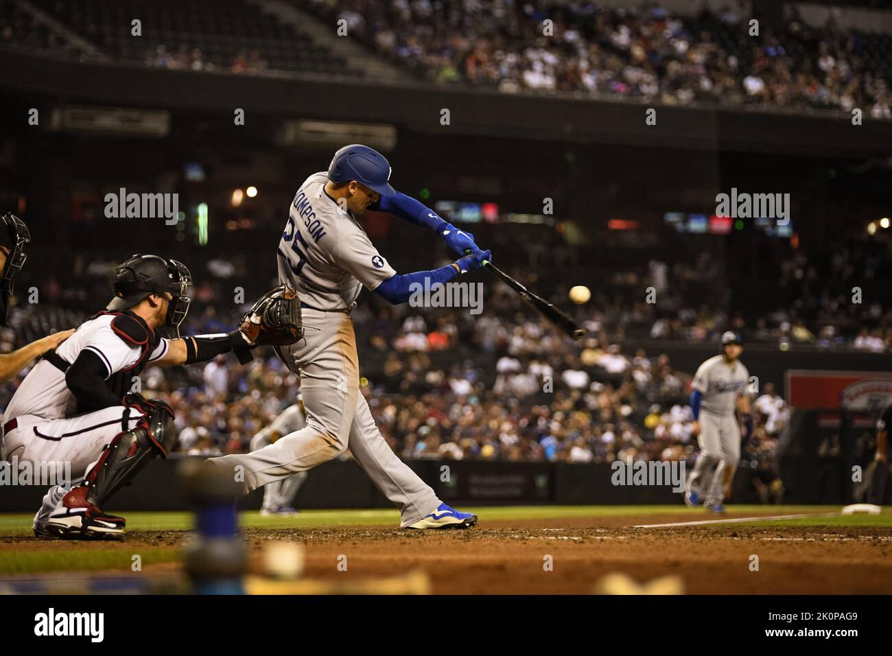 Los Angeles Dodgers right fielder Trayce Thompson (25) hits a sacrifice ...