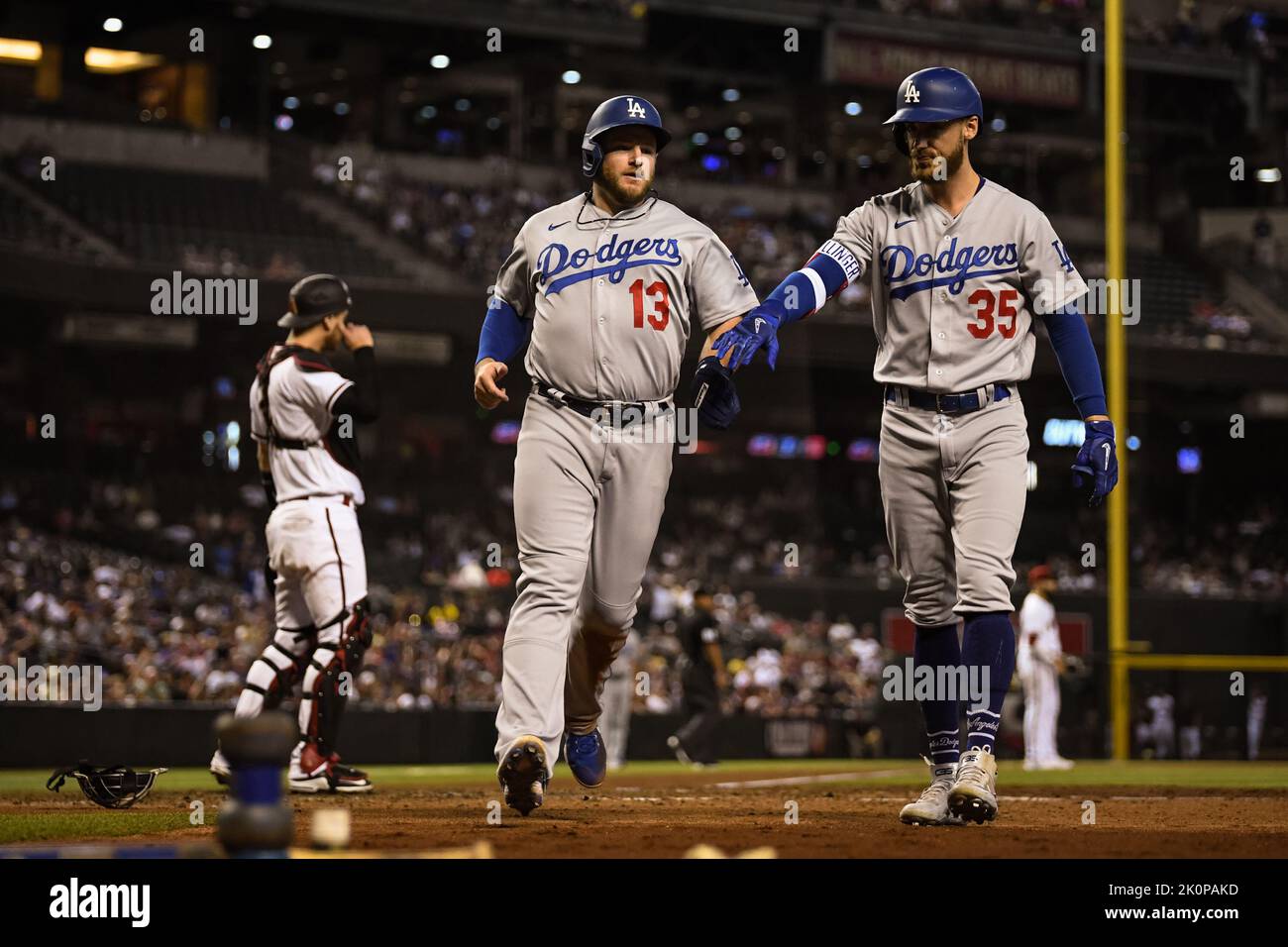 Los Angeles Dodgers third baseman Max Muncy (13) celebrates with center ...