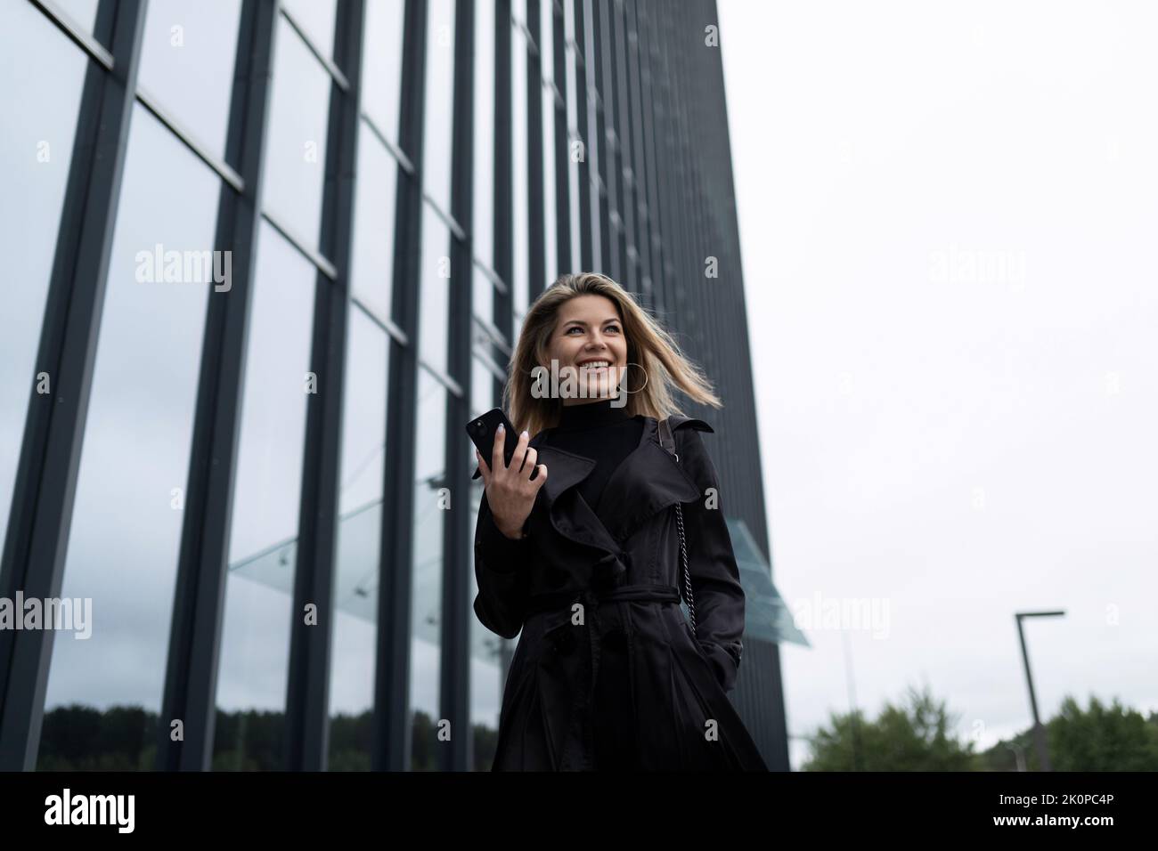 presentable middle-aged woman head hurries to work with a smile on her ...