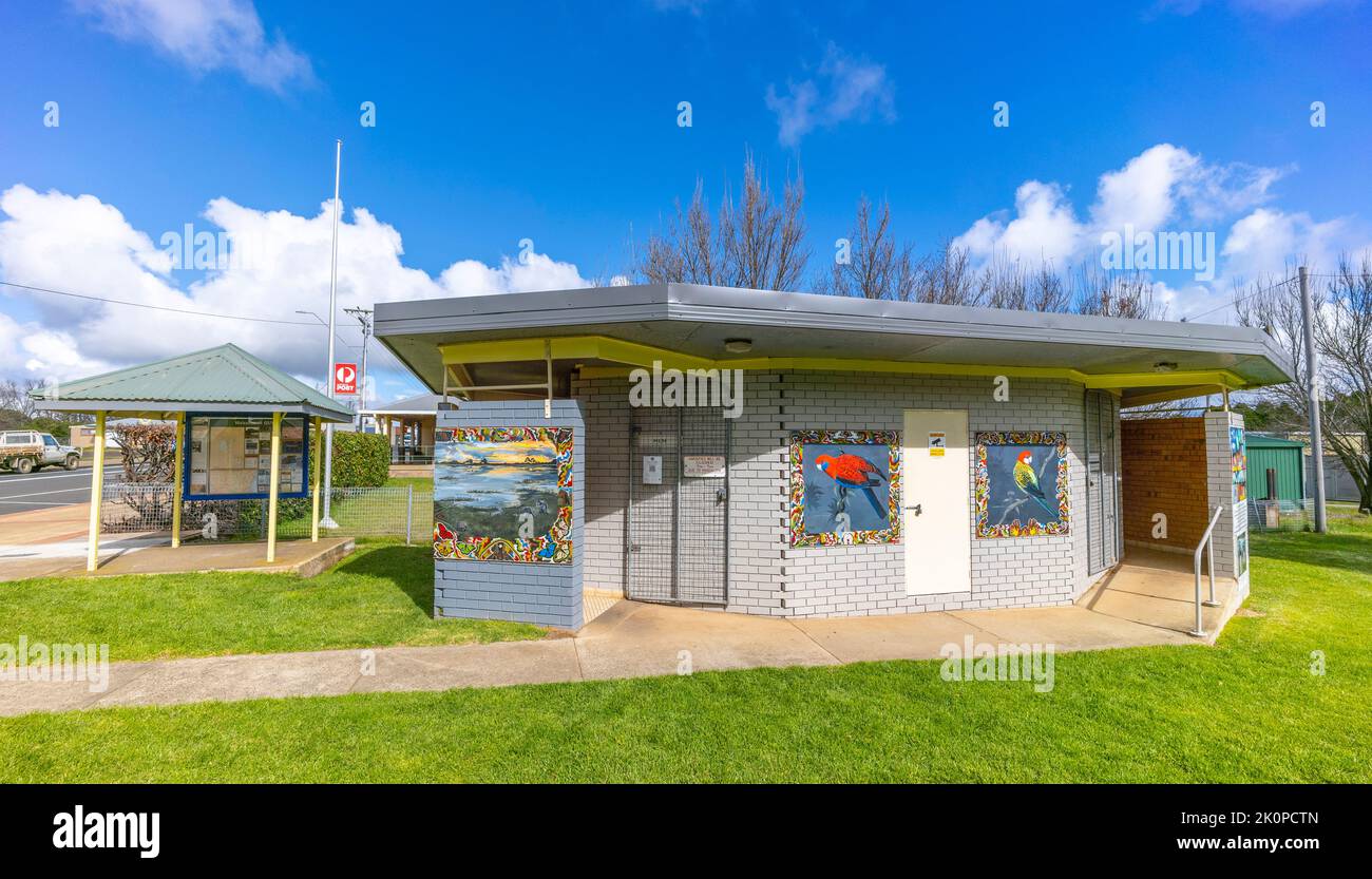public toilets with Mural painted on wall alongside public notice ...