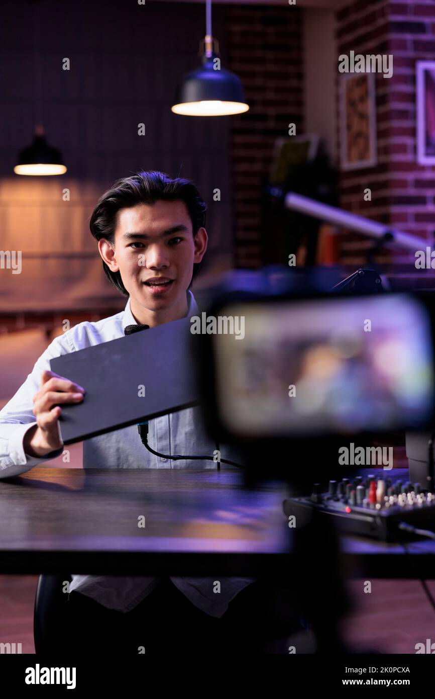 Content creator recording laptop recommendation for social media ...