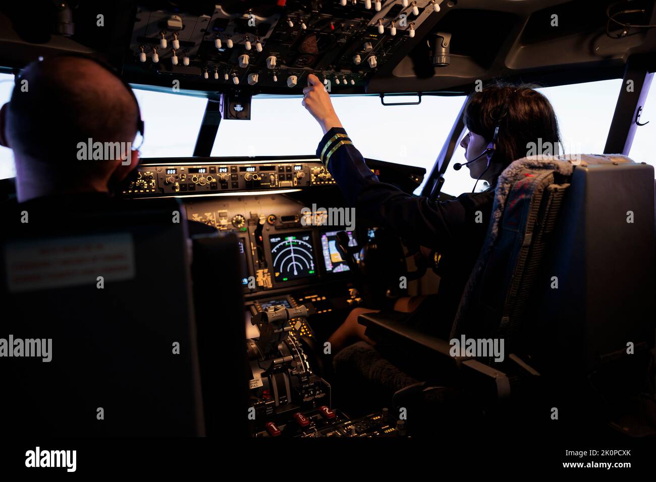 Captain and copilot switching power engine buttons on dashboard and ...