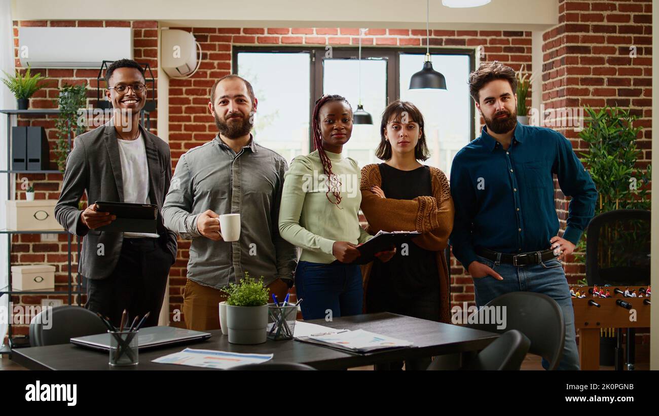 Portrait of coworkers planning business presentation in office, diverse ...