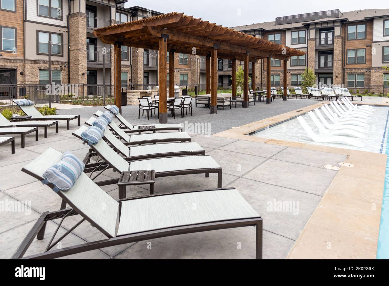Deck chairs in the backyard of the residential complex, recreation zone ...
