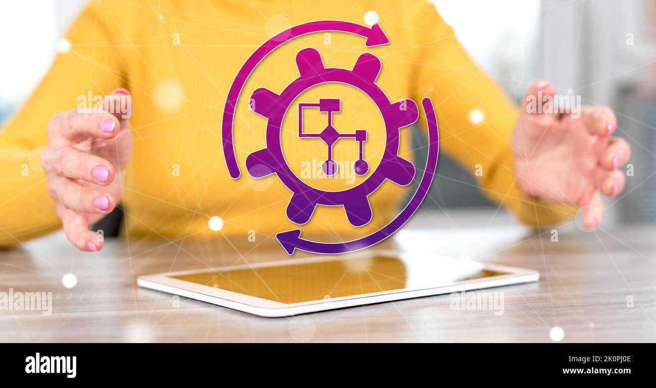 Digital tablet with workflow concept between hands of a woman in ...