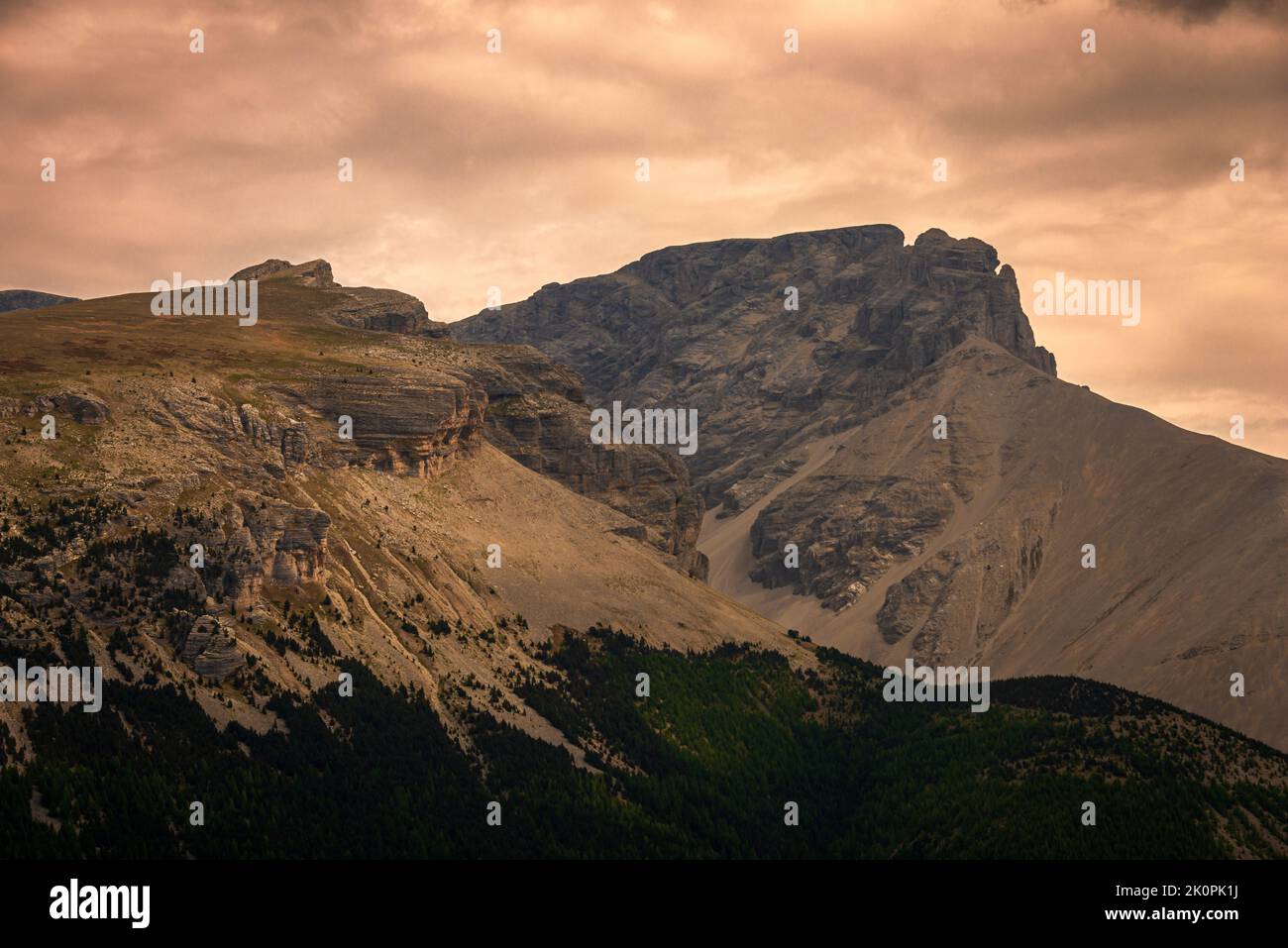 small peaks in the The French alps with stormy weather clouds ...