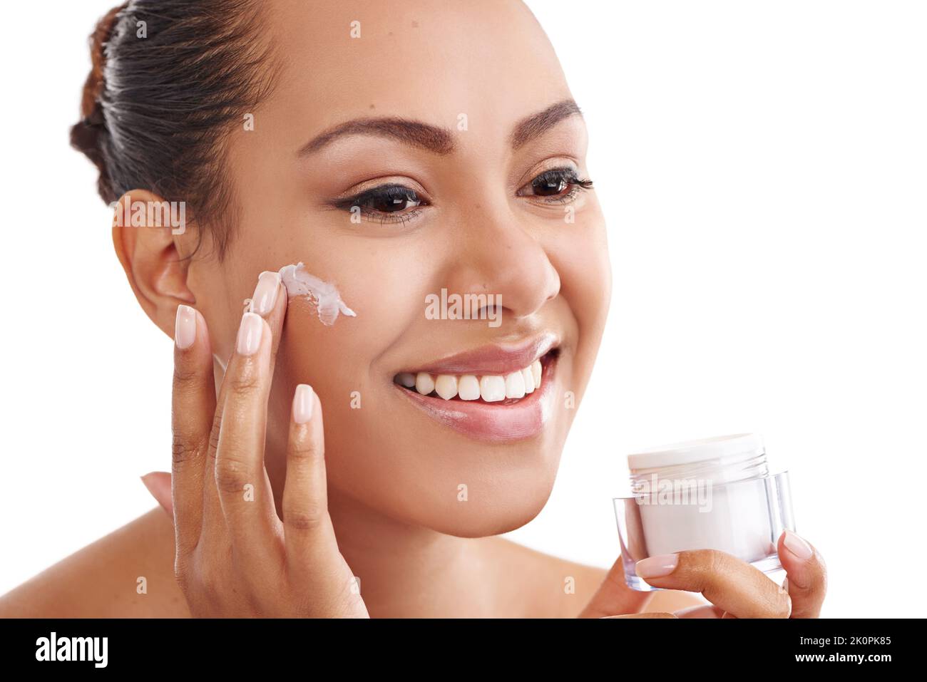 The steps to beautiful skin. Studio shot of a beautiful young woman ...