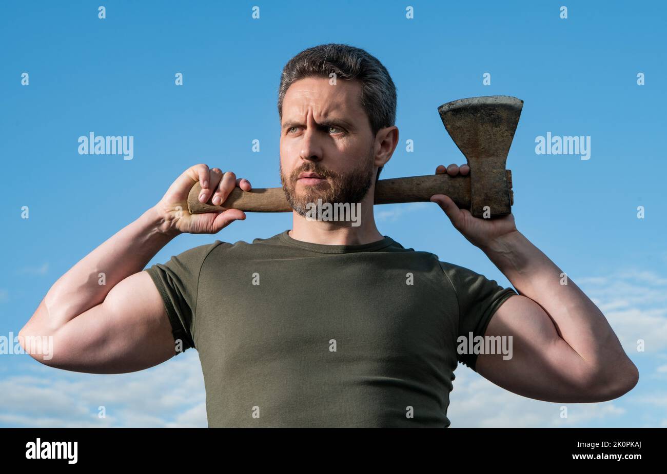 confident man with axe. caucasian woodsman man hold ax. brutal man on ...