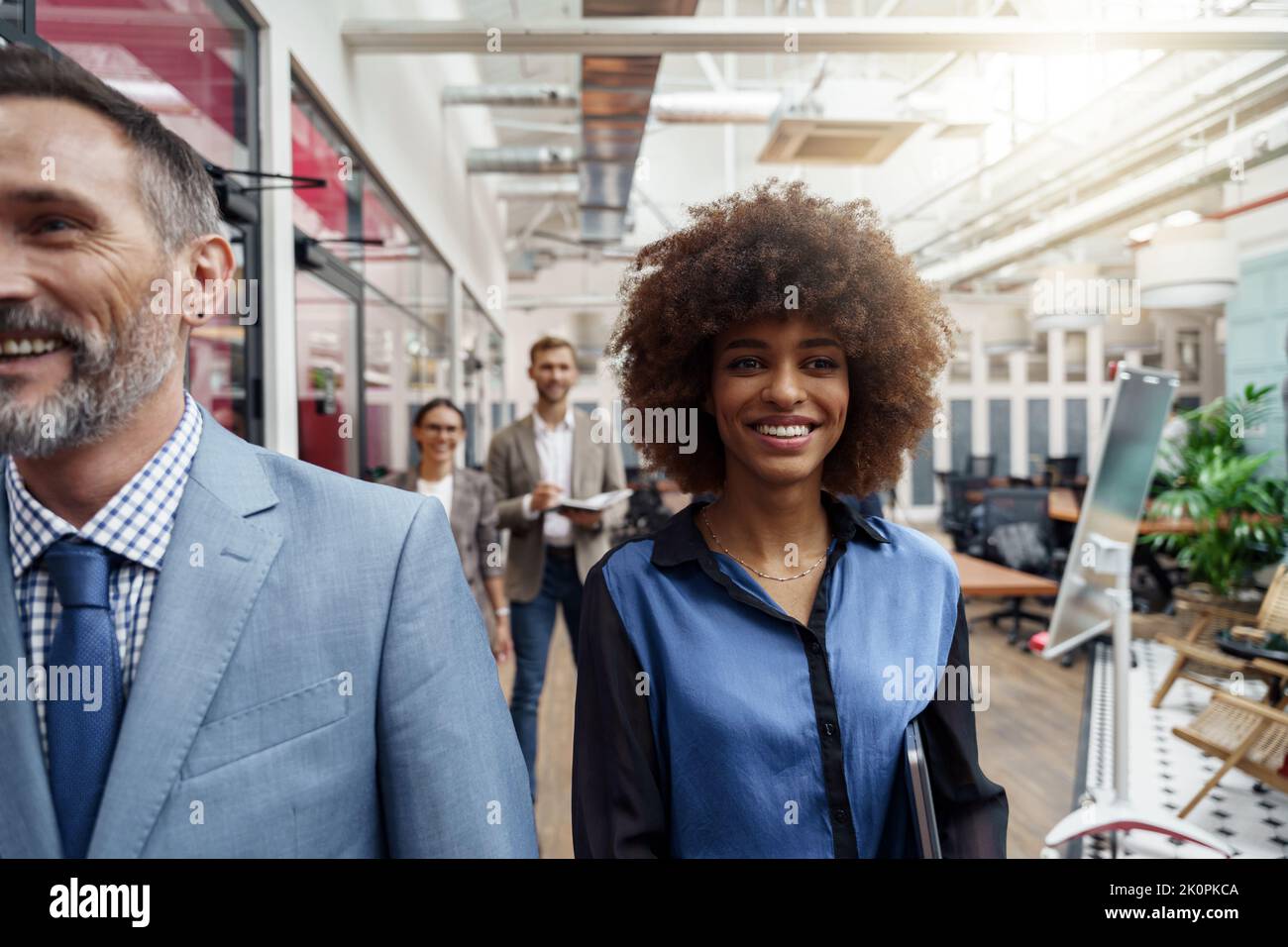 Group of multiethnic business people crossing office together Stock ...