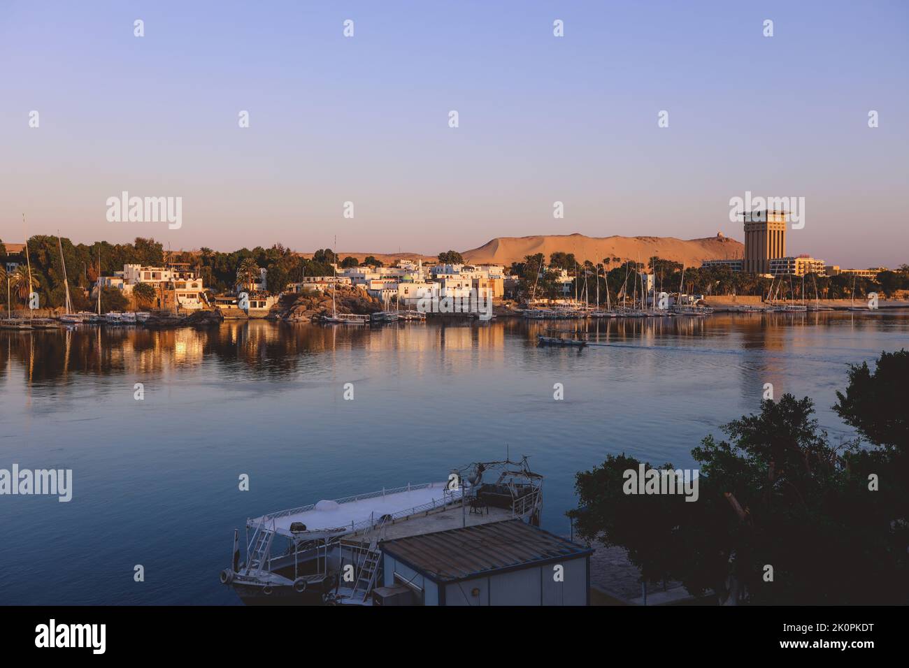 Sunset View to the Panoramic Aswan cityscape with the Palm Trees, Egypt ...