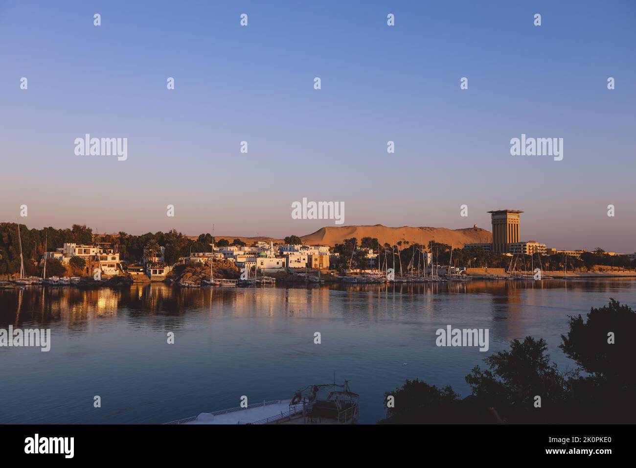 Sunset View to the Panoramic Aswan cityscape with the Palm Trees, Egypt ...