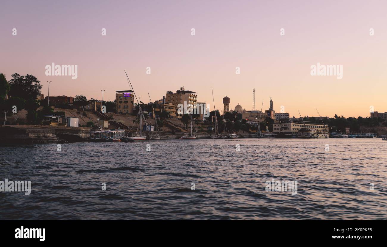 Sunset View to the Panoramic Aswan cityscape with the Palm Trees, Egypt ...