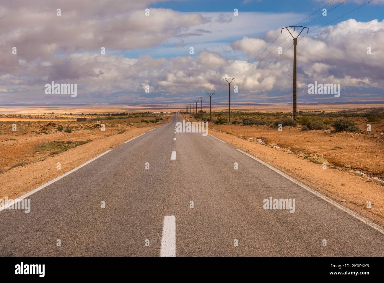 Endless asphalt road in dry stone Morocco desert Stock Photo - Alamy