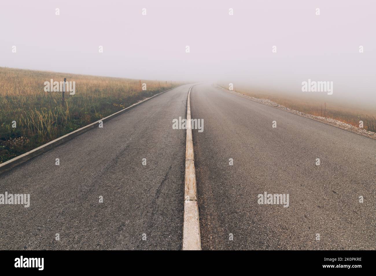 Empty asphalt road and pedestrian walkway in beautiful Zlatibor ...