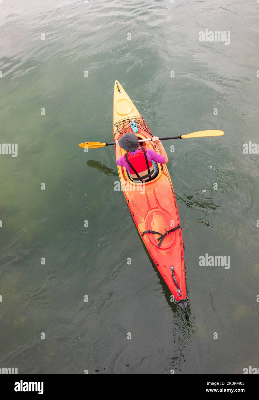 Middle-aged person kayaking on the lake Stock Photo - Alamy