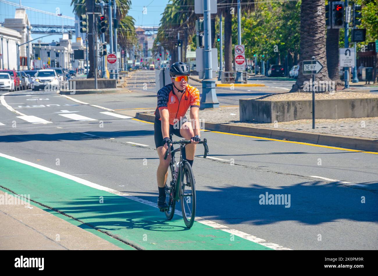 A cyclist cycles down a dedicated cycle lane in San Francisco ...