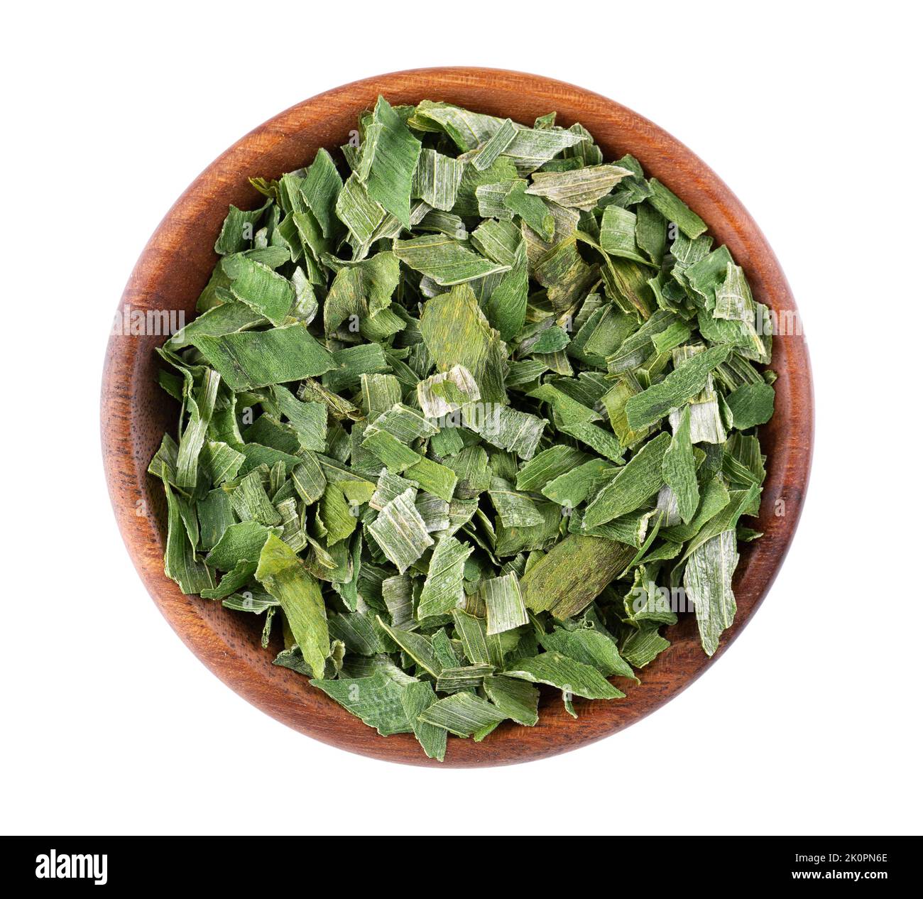 Dry chopped spring onion in wooden bowl, isolated on white background ...
