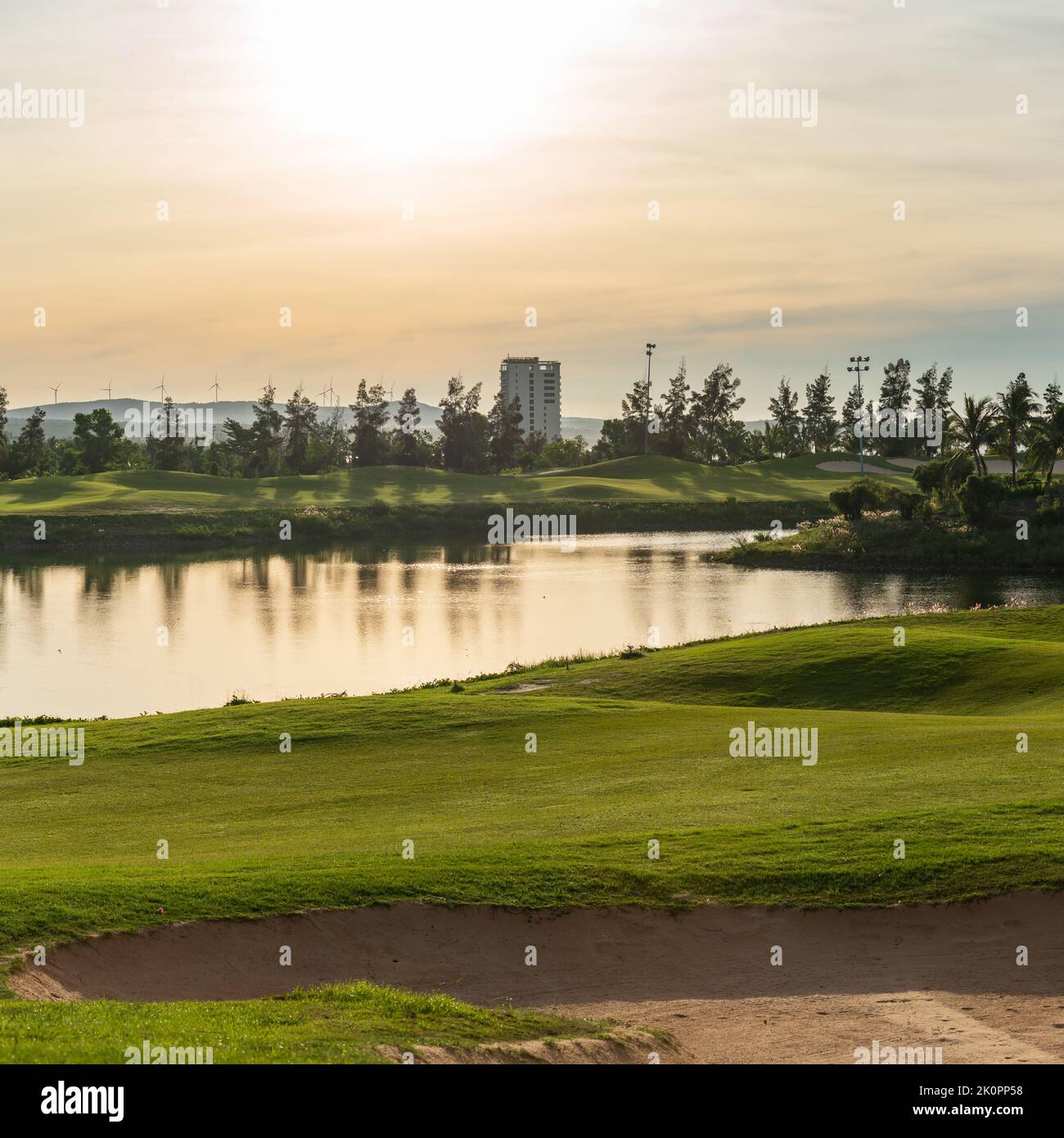 BANNER Orange red dawn sun sky golf pond water reflection hills green ...