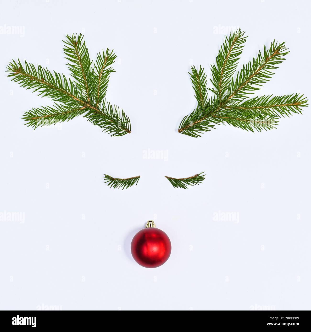 Creative reindeer made with Christmas ornaments and fir branches on ...