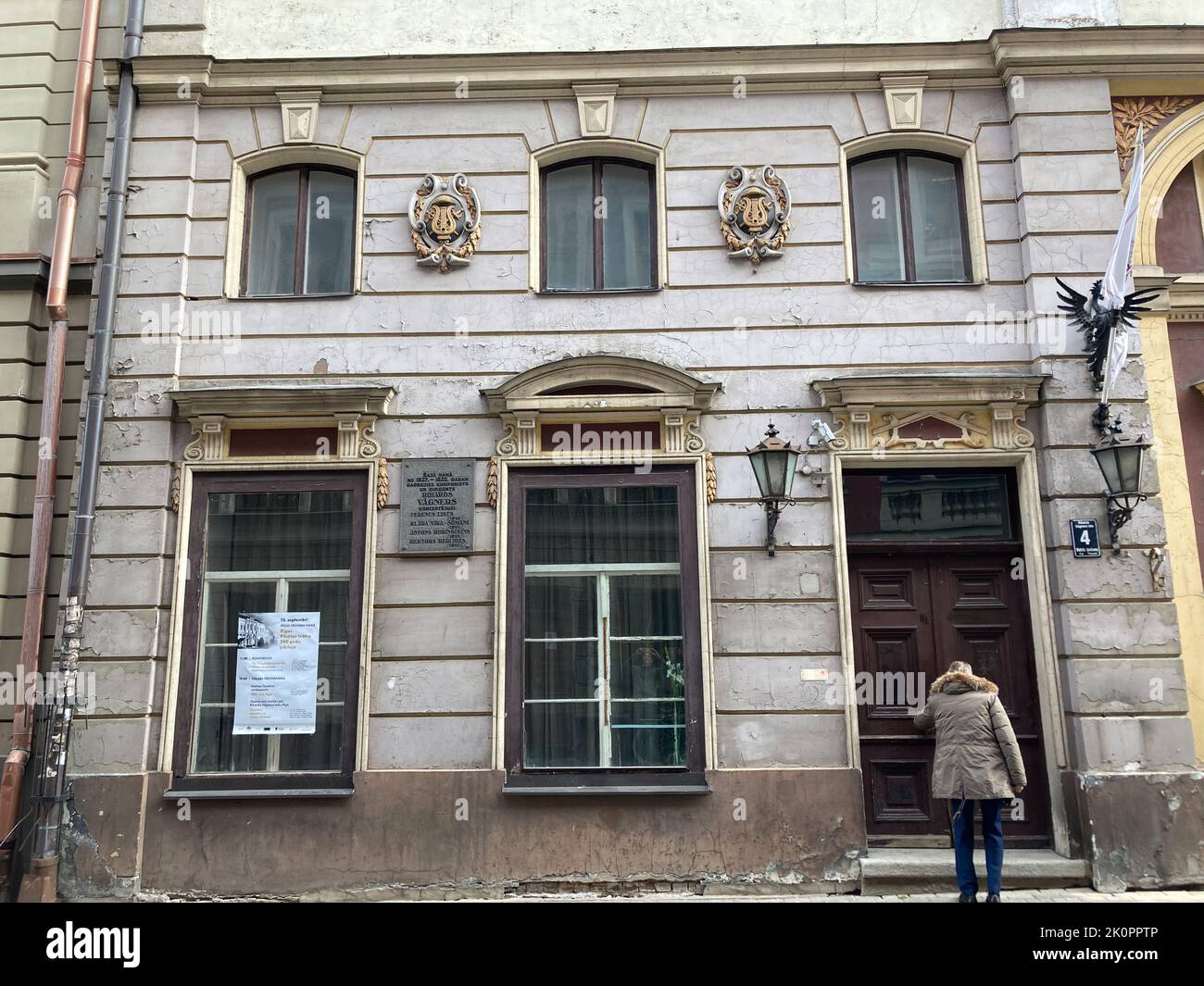 Riga, Latvia. 13th Sep, 2022. A man stands in front of the entrance to ...