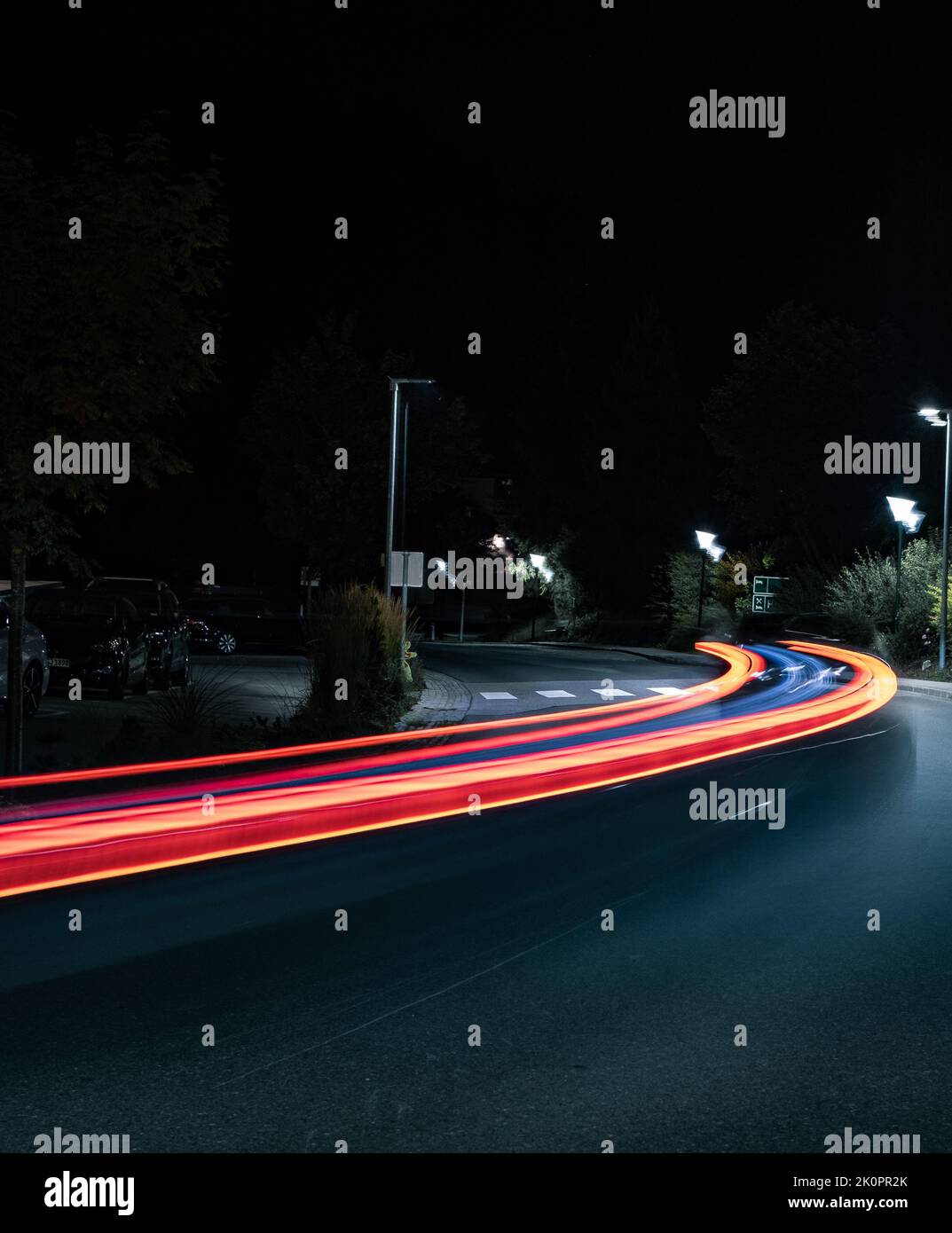 The neon tracks from cars at night street Stock Photo - Alamy
