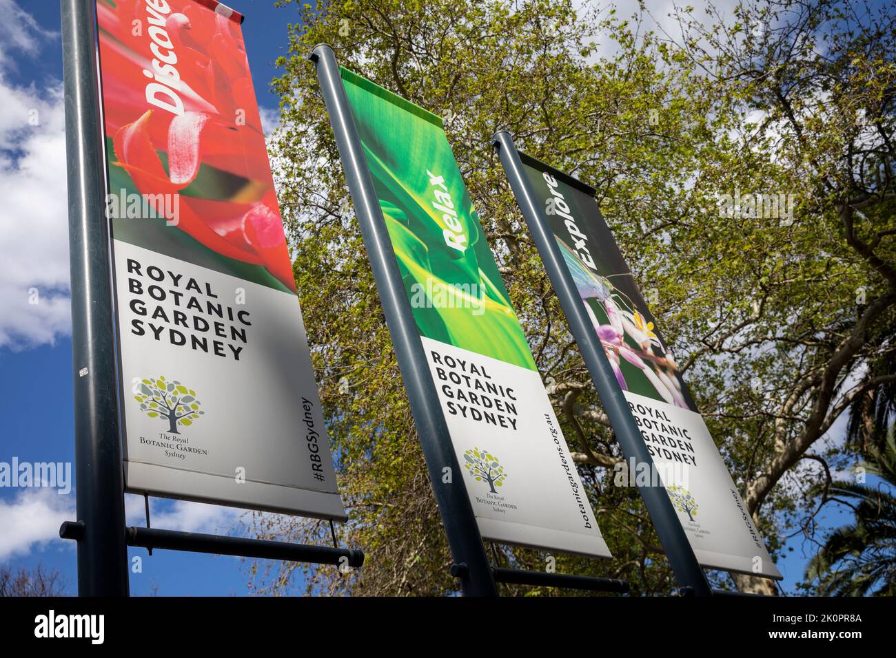 Signs and banners at the entrance to the Royal botanic Garden in Sydney ...