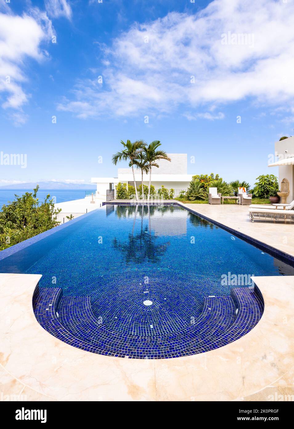 The beautiful vertical view of a resort pool before the seascape under ...