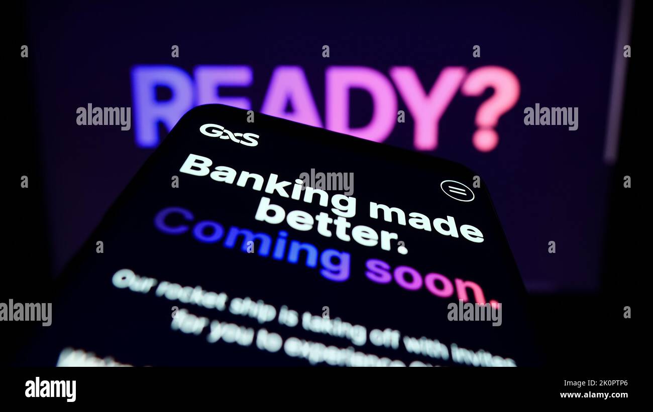 Mobile phone with web page and logo of Singaporean company GXS Bank Pte ...
