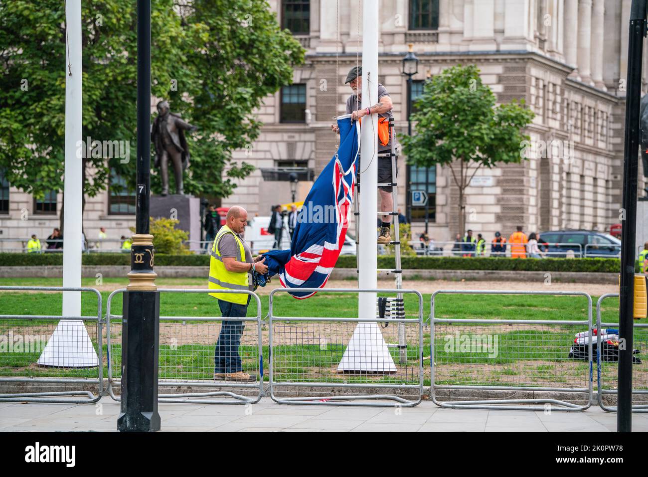 London UK. 13 September 2022. Flags engineers hang the flags of British ...