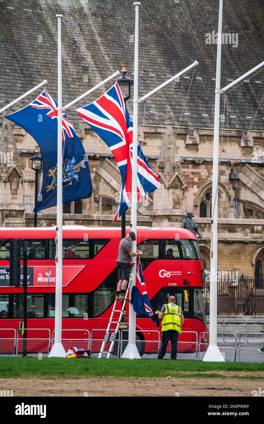 London UK. 13 September 2022. Flags engineers hang the flags of British ...