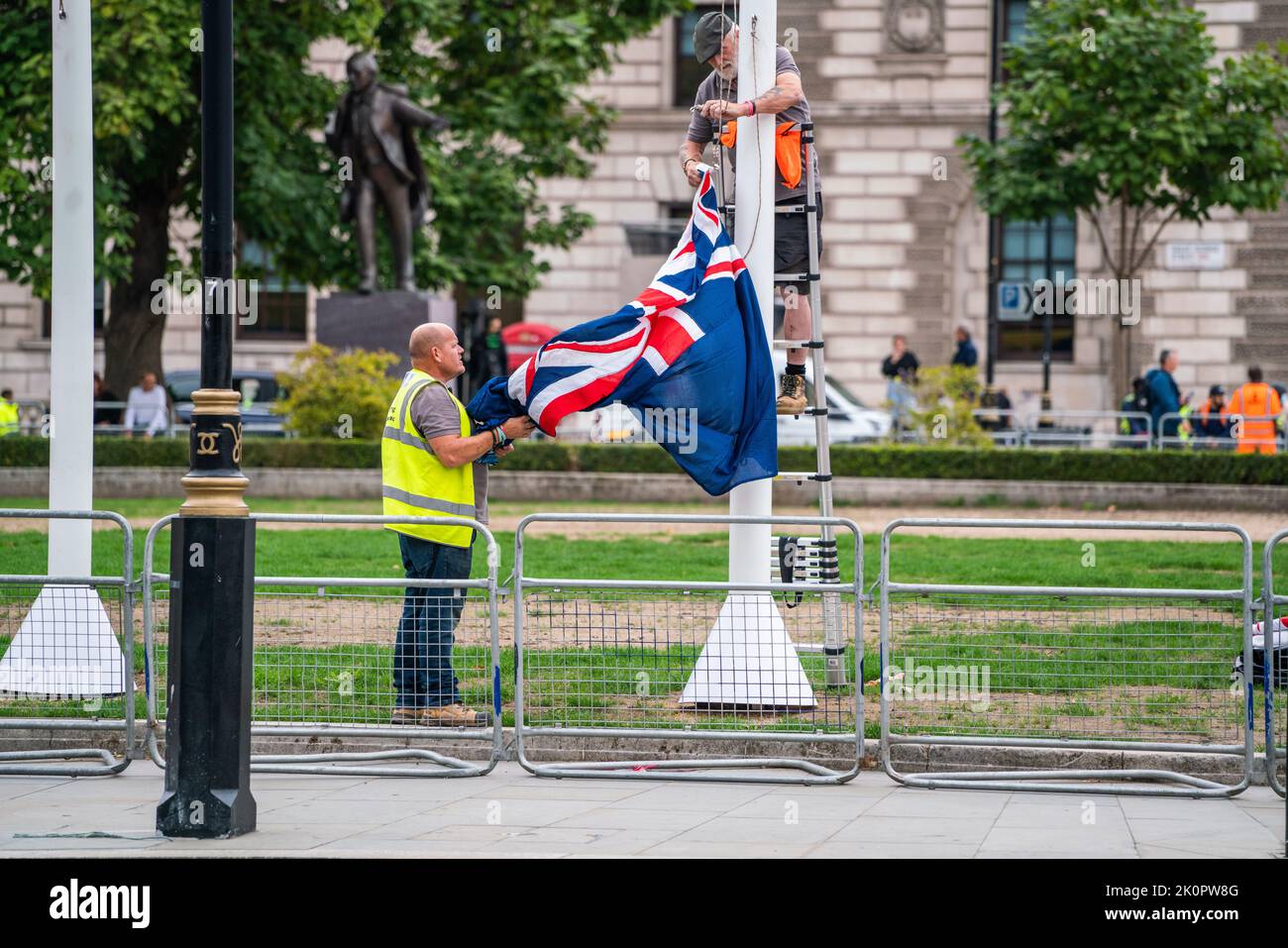 London UK. 13 September 2022. Flags engineers hang the flags of British ...