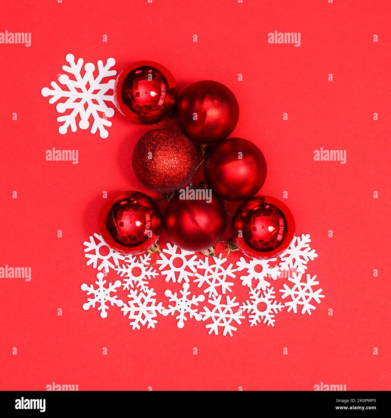 Creative Santa Clous hat made with snowflakes and ornaments on red ...