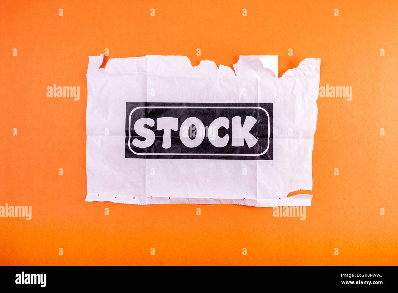 Word stock. Stock photography concept. Folded white paper with the word ...