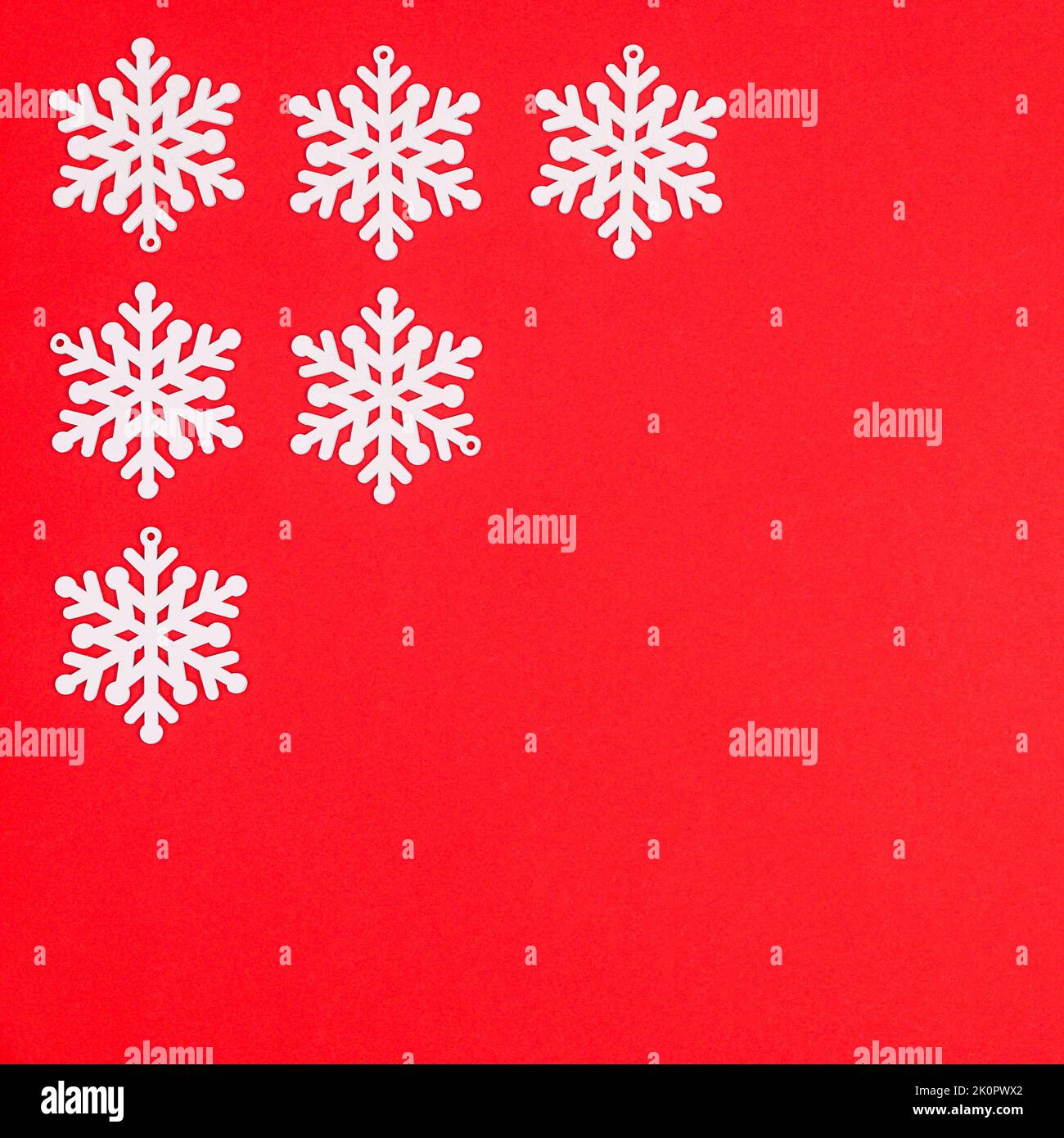 Snow flakes in corner of red background with copy space. Fat lay Stock ...
