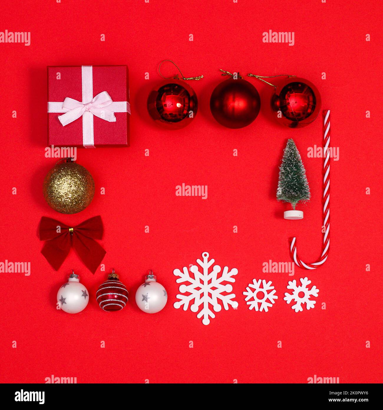 Creative Christmas layout with ornaments frame on red background. FLat ...