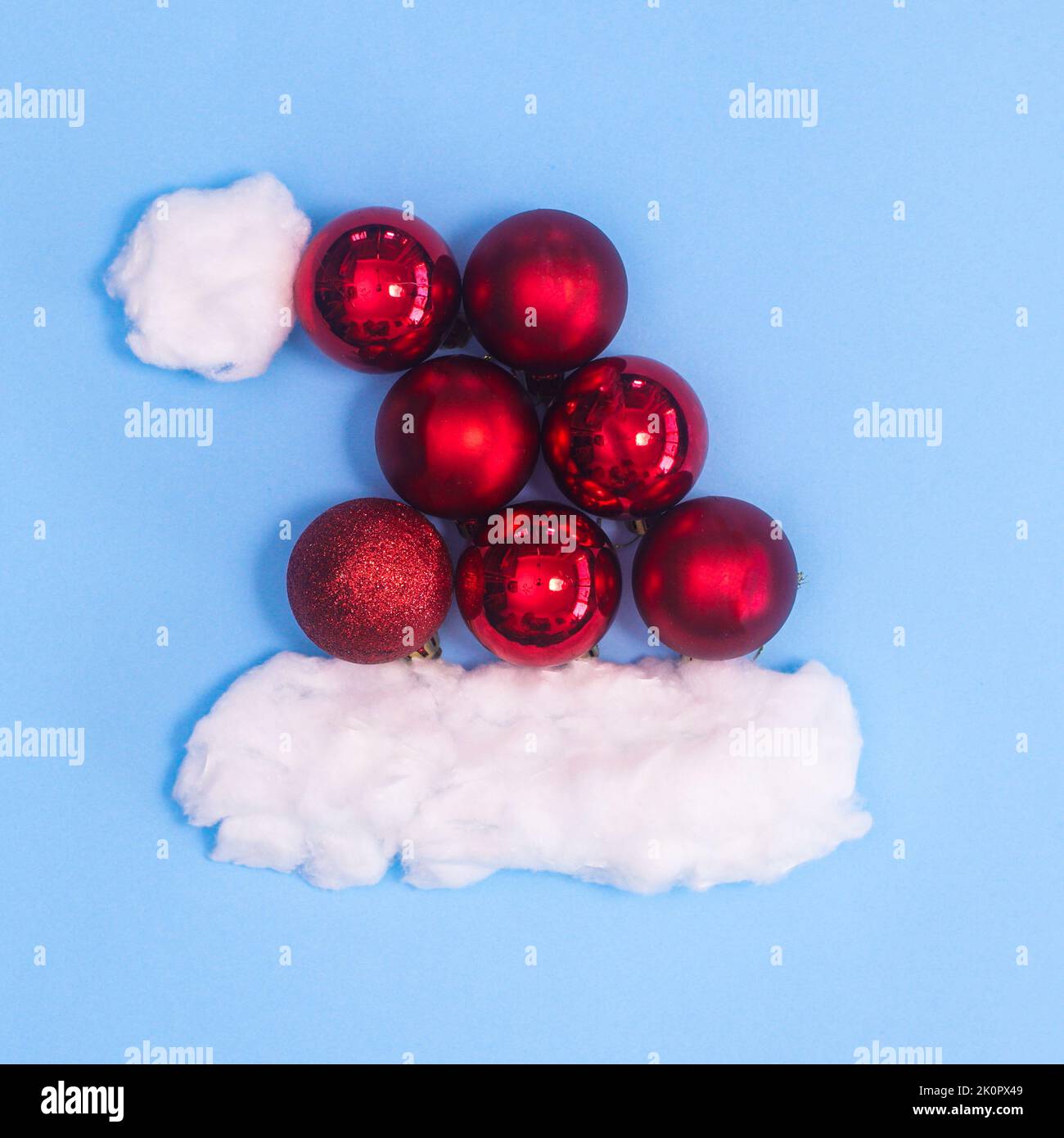 Creative Santa clous cap made with cotton and Chrsitmas balls on blue ...