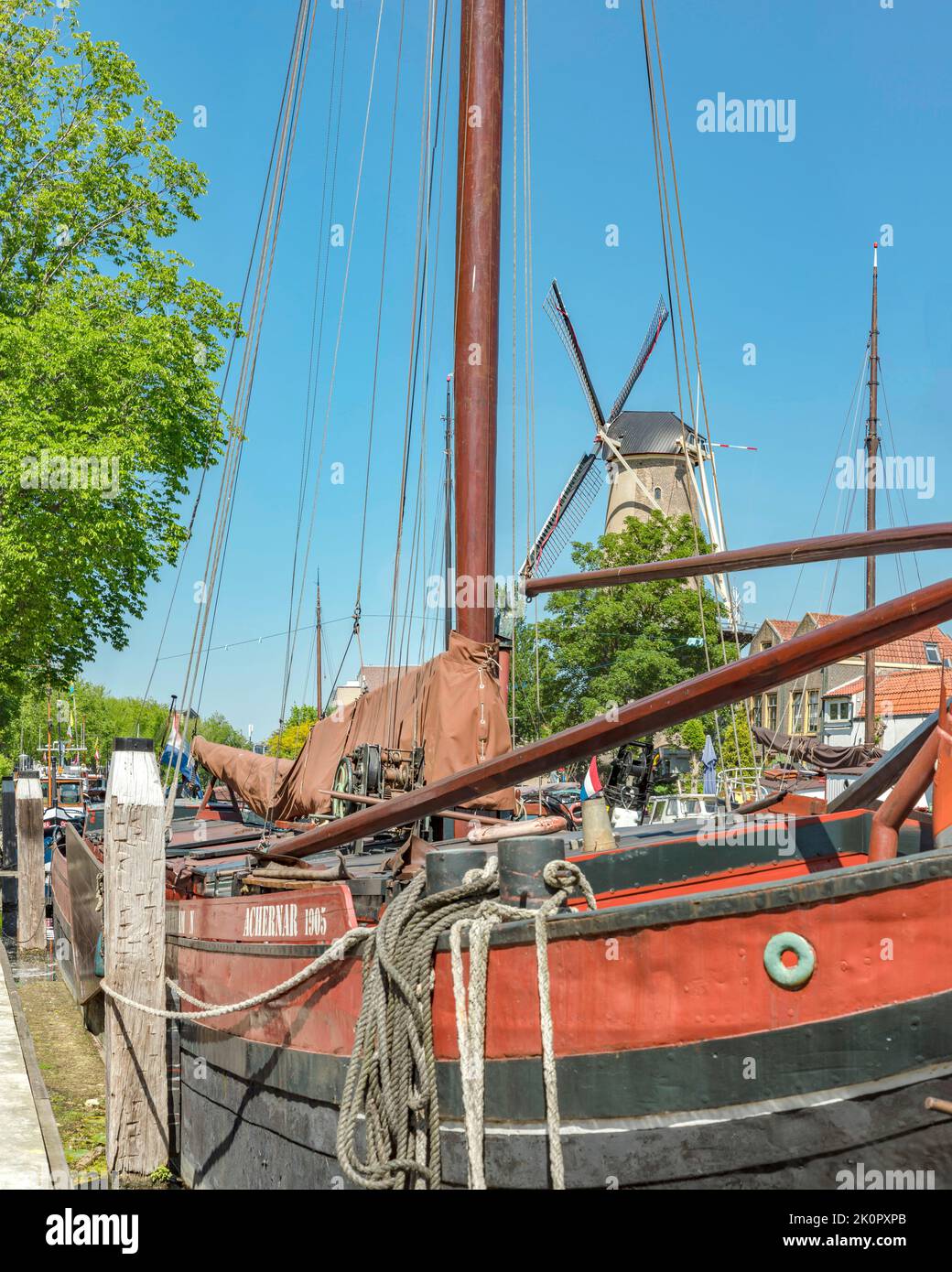 Ancient sailingships at the Museum-port, windmill called De Roode Leeuw ...