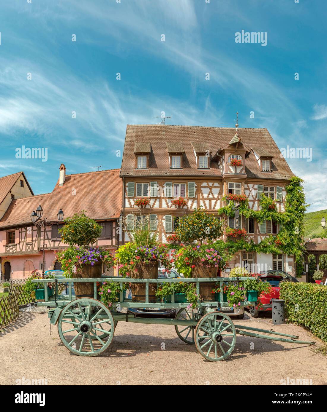Half timbered house and a wagon full of flower pots hi-res stock ...