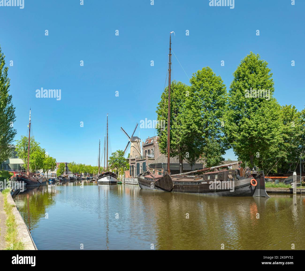 Ancient sailingships at the Museum-port, windmill called De Roode Leeuw ...