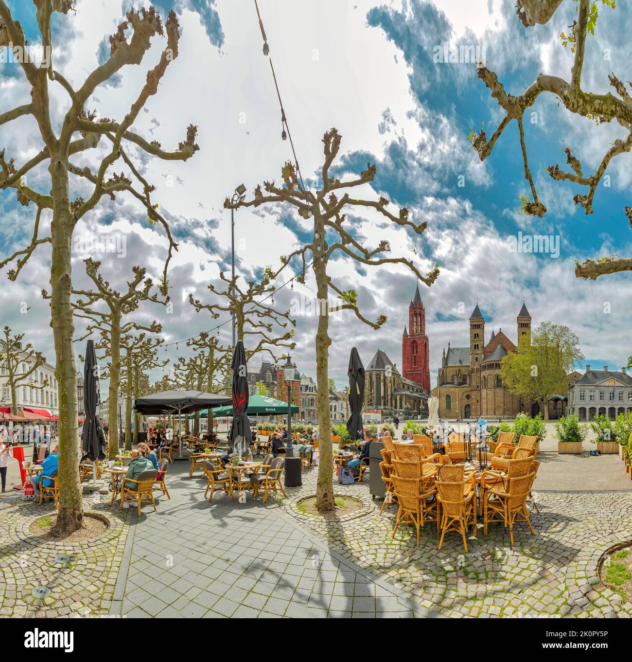 Outdoor cafe at the Vrijthof square with the Basilica of Saint Servaas ...