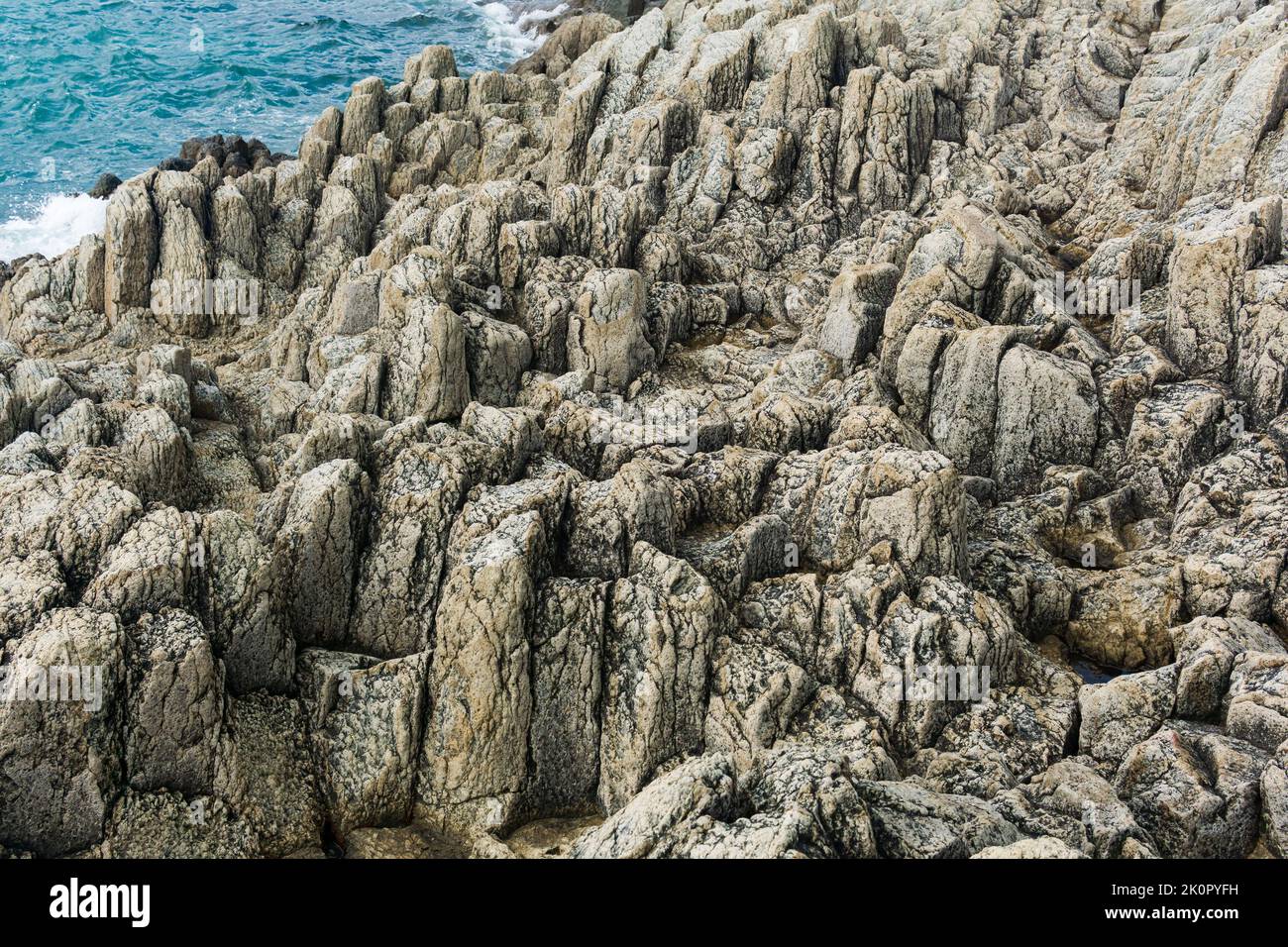 natural stone background, the remains of lava basalt columns form a ...